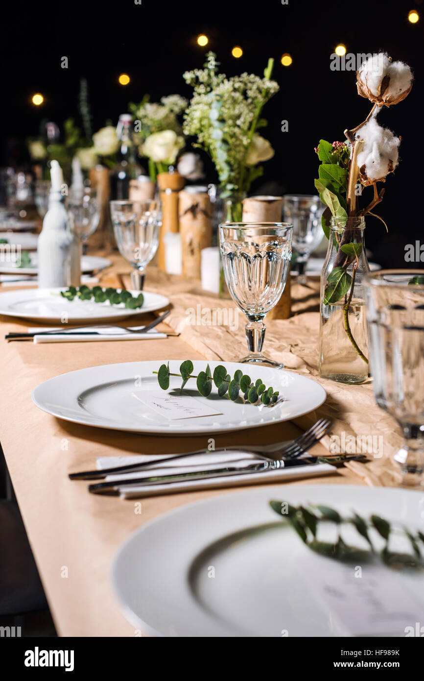 Decorated table ready for dinner. Beautifully decorated table set with ...