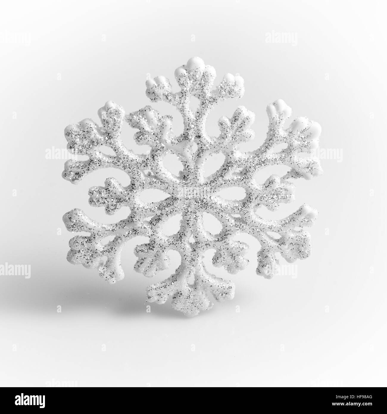 White Snowflake on a white background. Winter symbol Stock Photo - Alamy