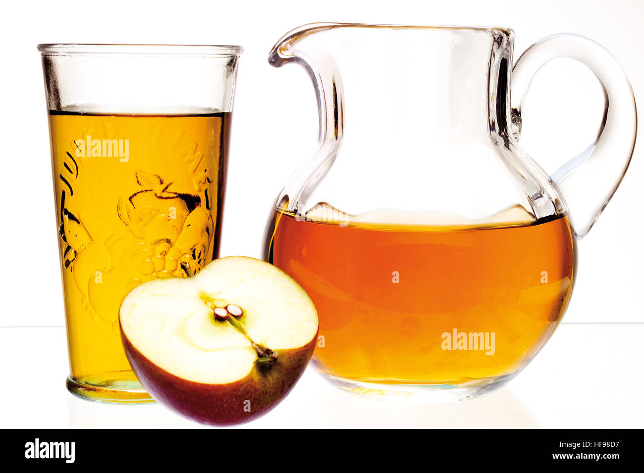 Pitcher and glass of apple juice Stock Photo - Alamy