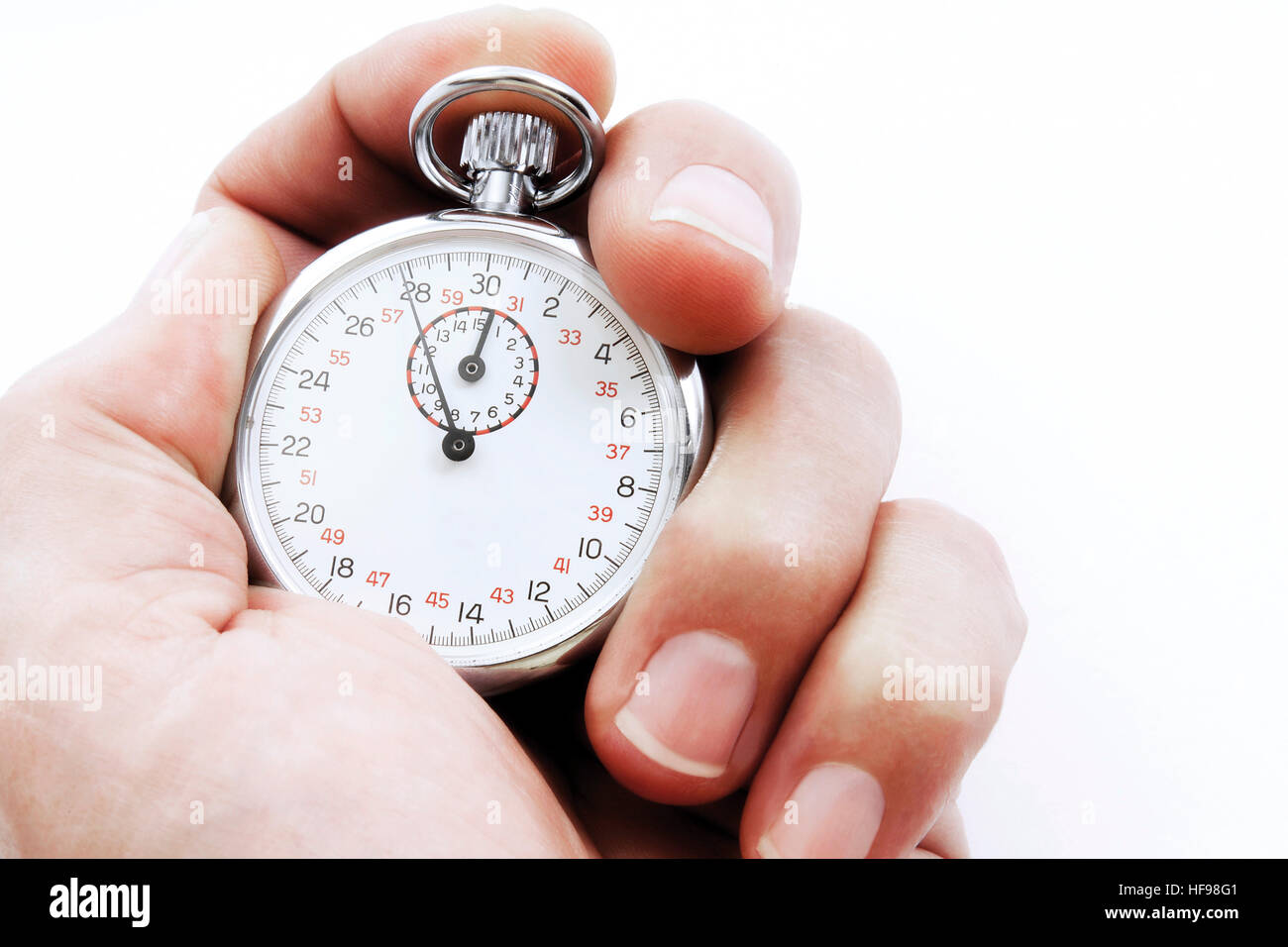 Hand holding a stopwatch Stock Photo - Alamy