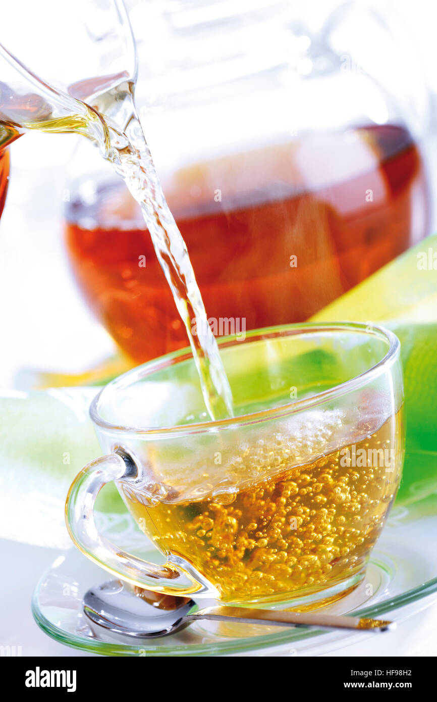 Tea poured into a cup Stock Photo - Alamy
