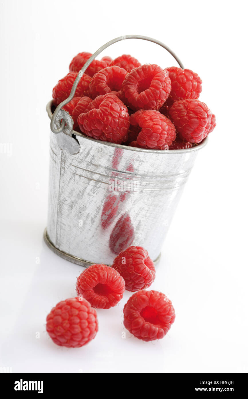 Small tin pail filled with raspberries Stock Photo - Alamy