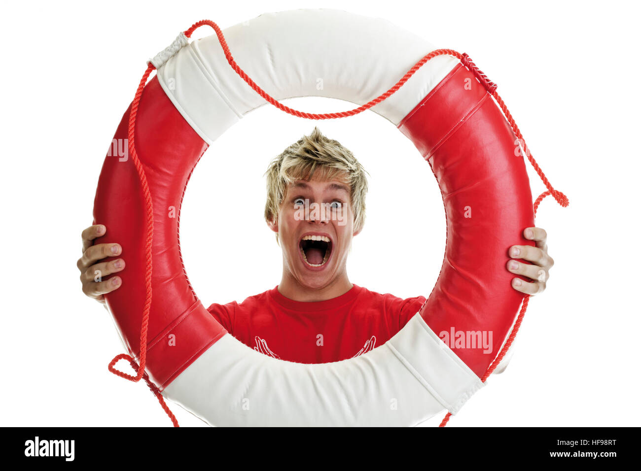 Young man screaming through lifesaver Stock Photo - Alamy