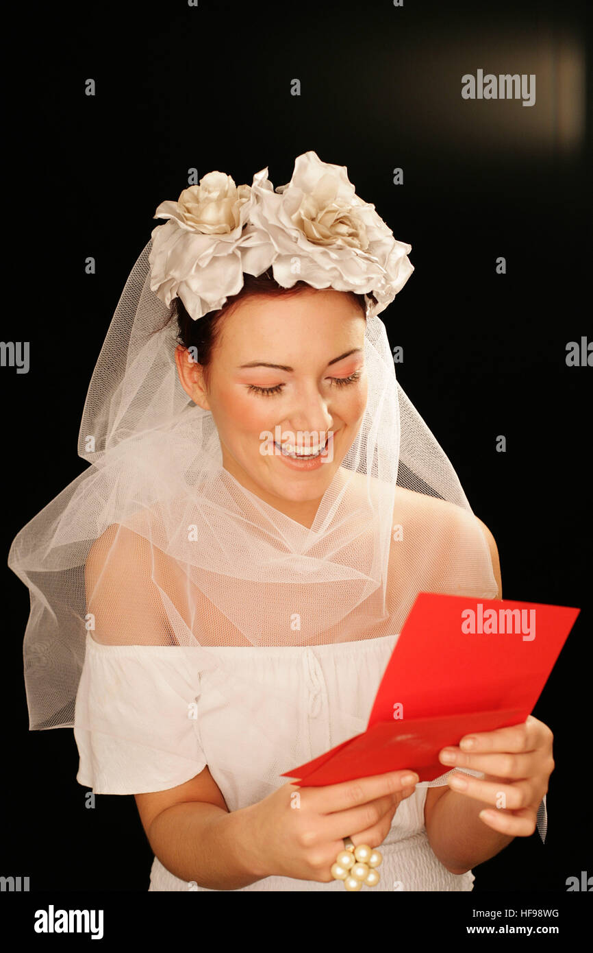 Woman reading wedding invitation hi-res stock photography and images ...