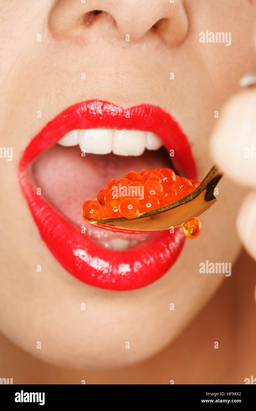 Woman enjoying caviar Stock Photo - Alamy