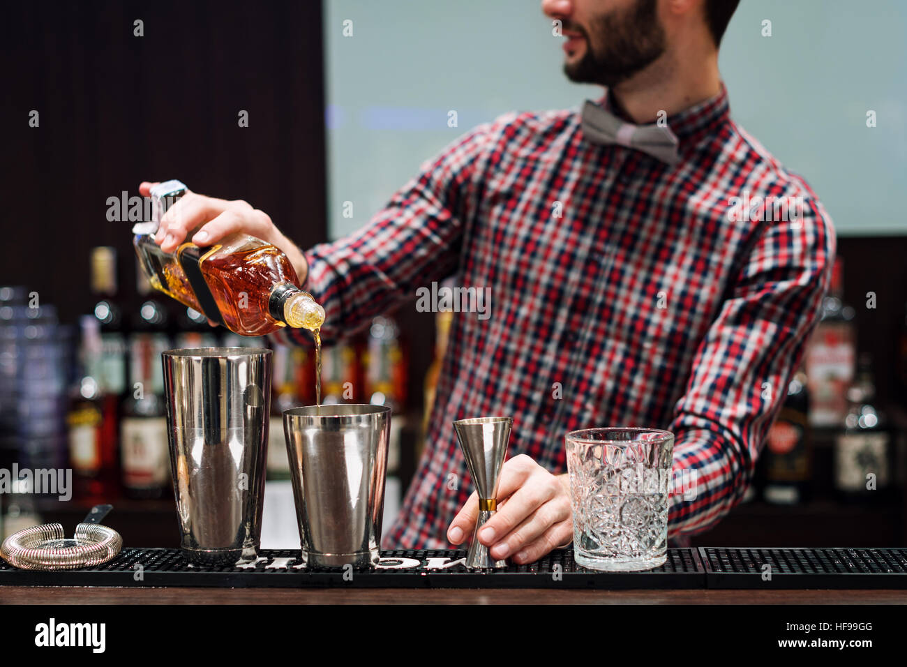 Barman show. Bartender is making cocktail at night club Stock Photo - Alamy