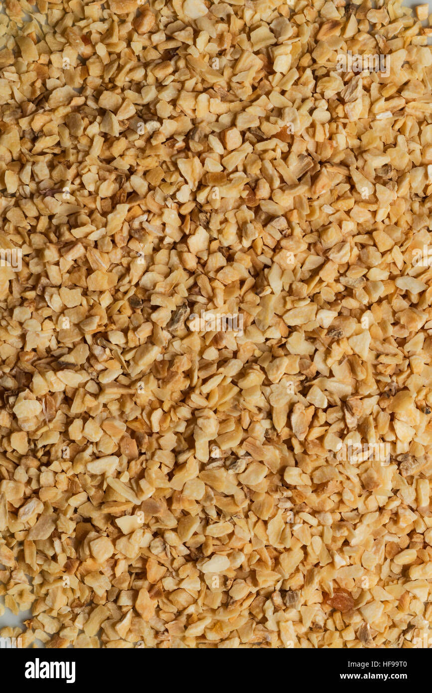 garlic flakes grouped together to form a background Stock Photo - Alamy