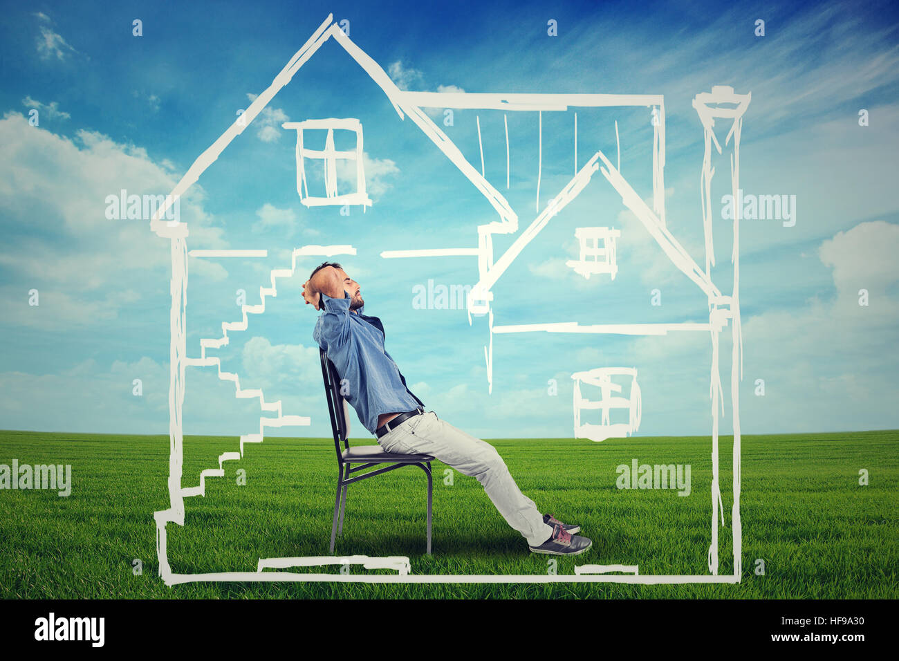 A safe house. Happy man enjoying his day in a new home surrounded by ...