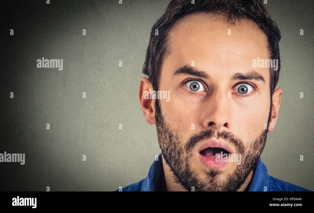 Astonished man. Closeup portrait guy looking surprised in full ...