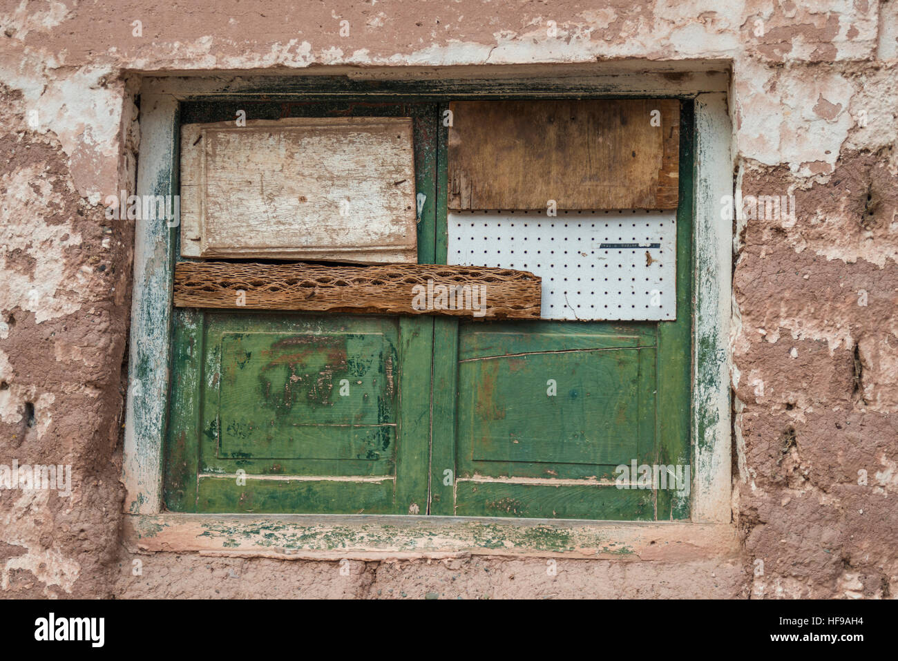 Old window in peeling walls house with the inscription "1931 Stock ...
