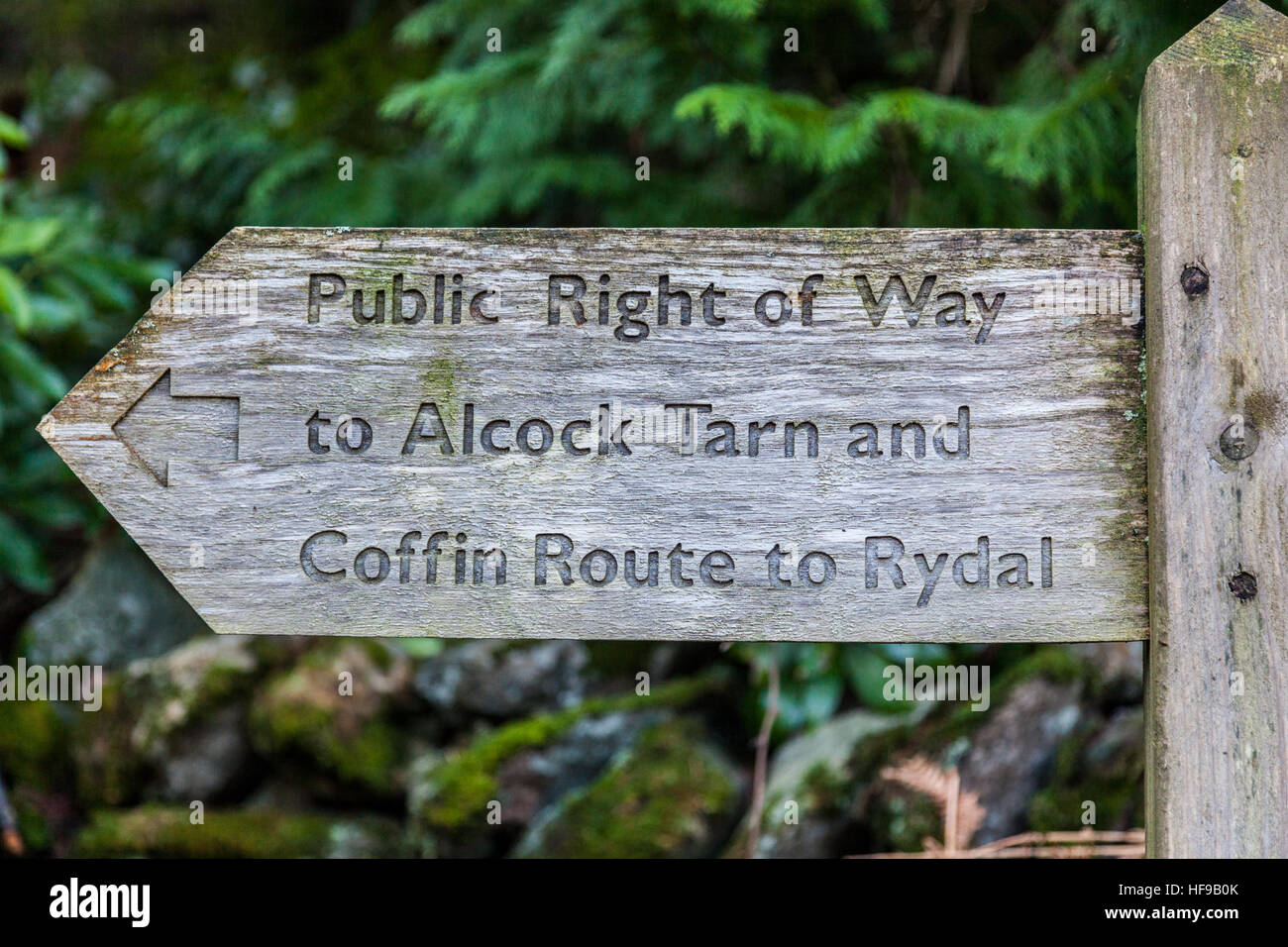 Footpath sign to Alcock Tarn and Coffin Route to Rydal, on minor road ...