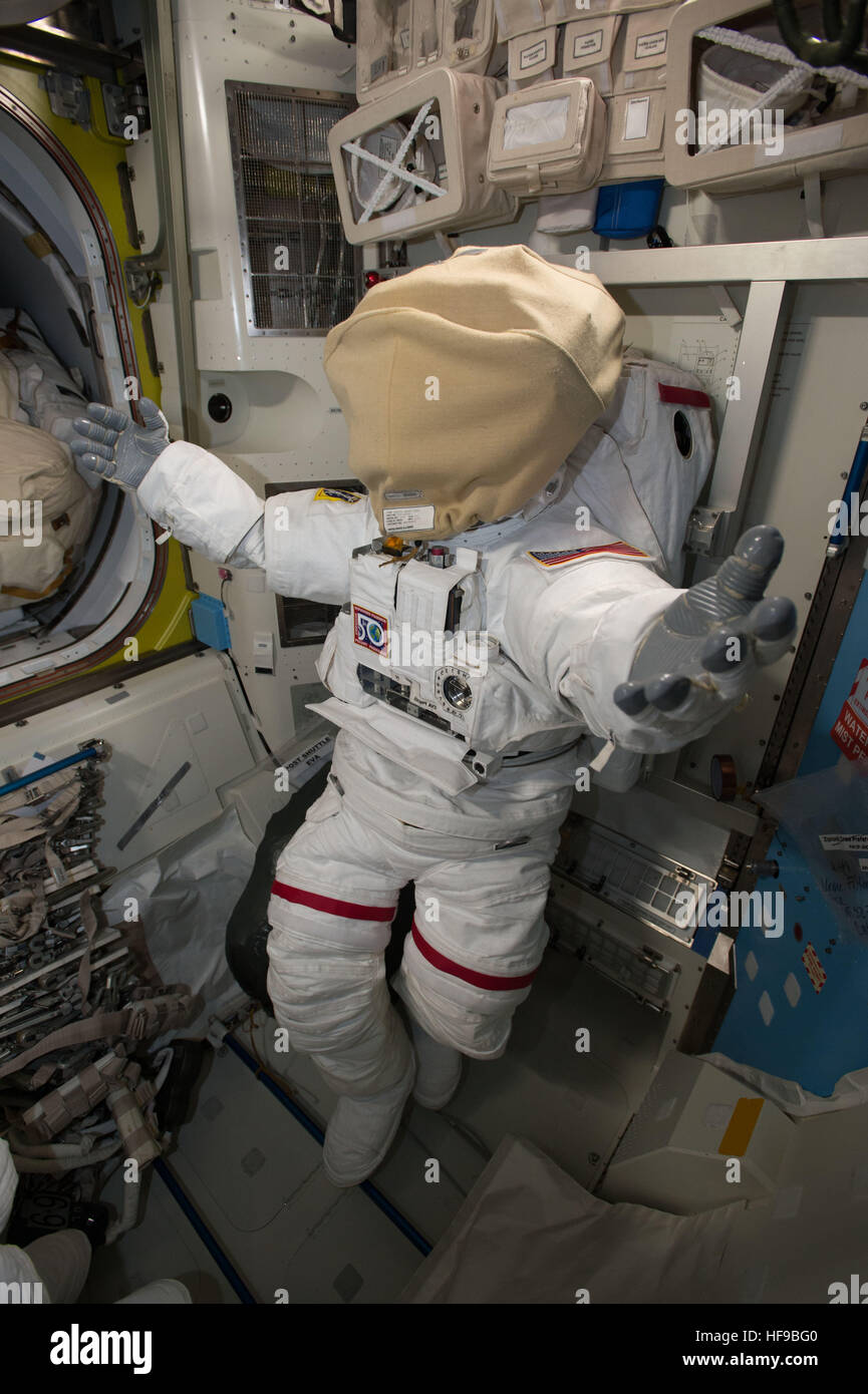 A U.S. spacesuit is attached to the wall inside the Quest Airlock ...