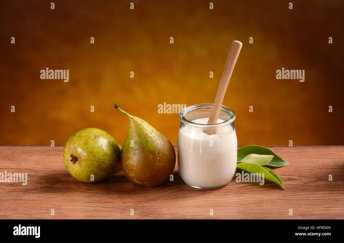 organic yogurt pear in glass jar Stock Photo - Alamy