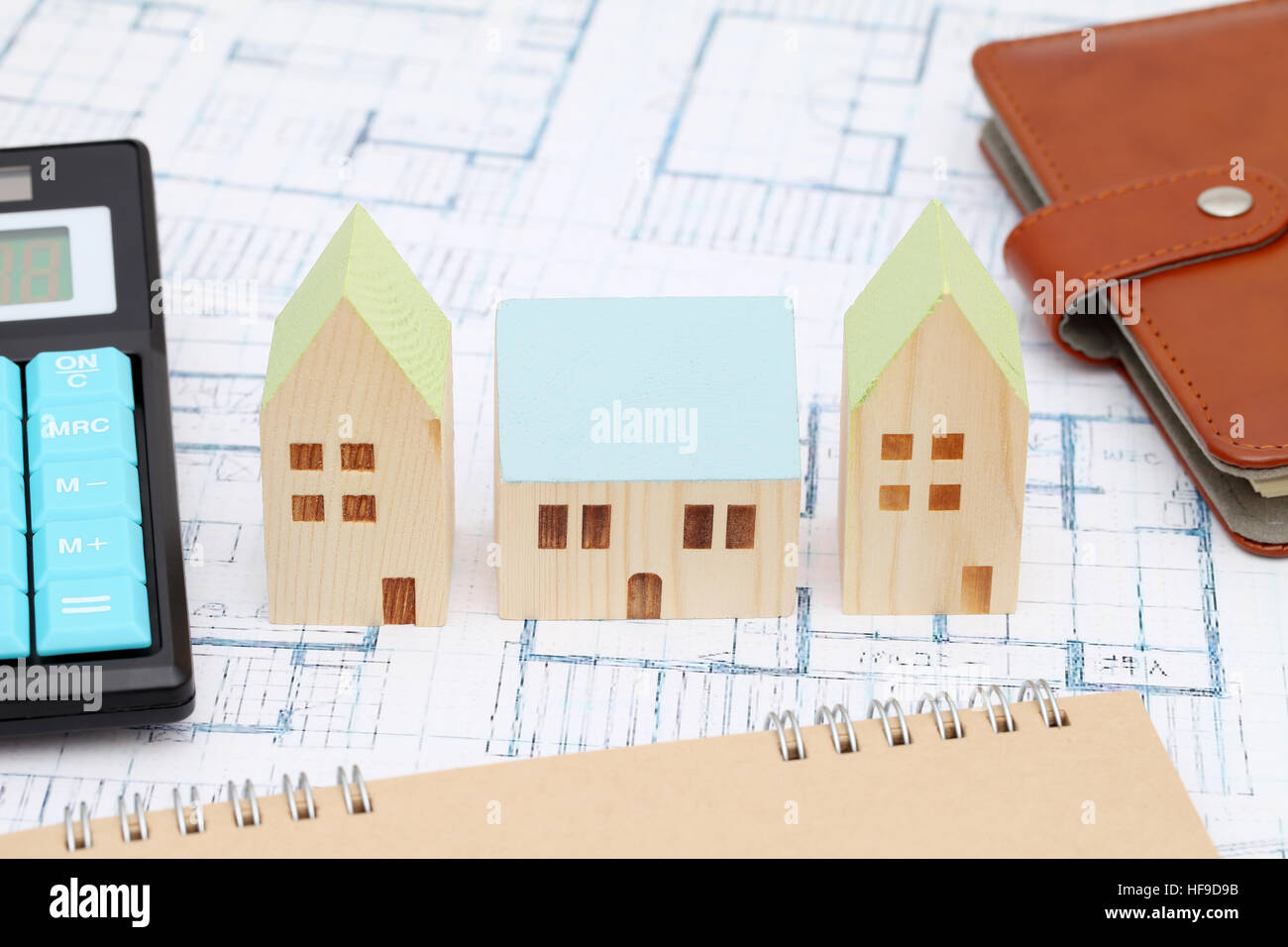 Miniature model of house on blueprints, construction plan Stock Photo ...