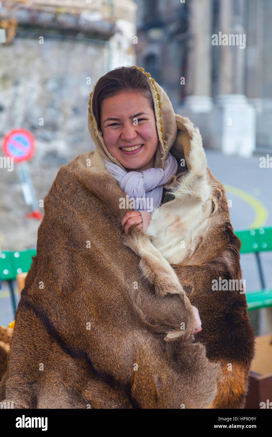Young woman wrapped in animal fur during Escalade in Geneva Stock Photo ...