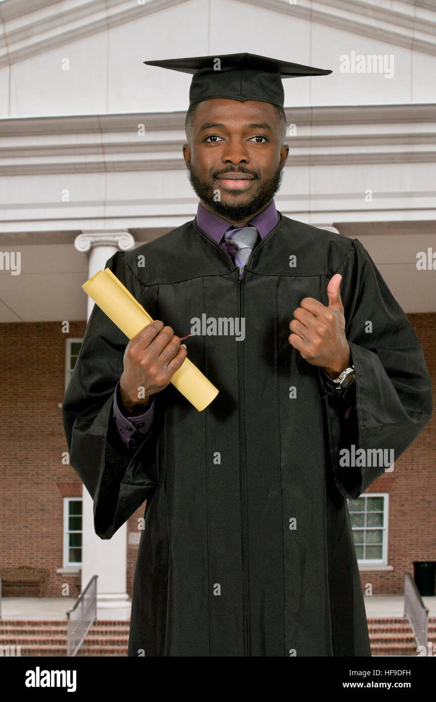 Young man in his graduation robes Stock Photo - Alamy