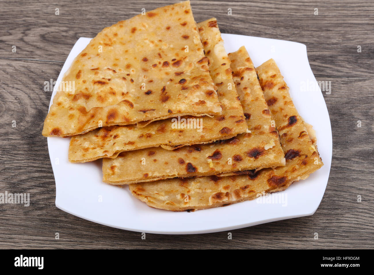 Indian bread roti on the plate in wood background Stock Photo - Alamy