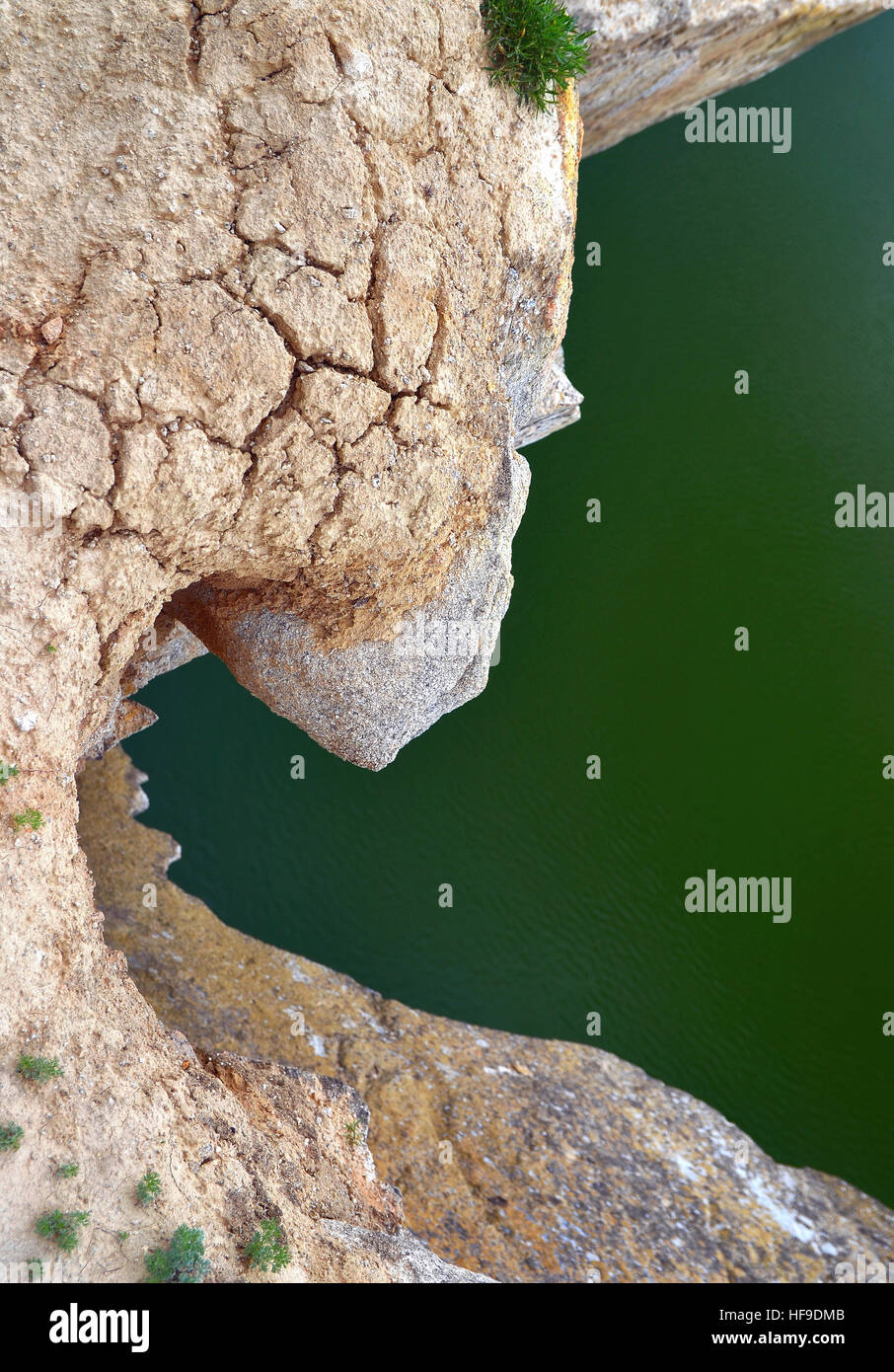 a stone jag seen from above one cliff of a lake seems like creating the ...