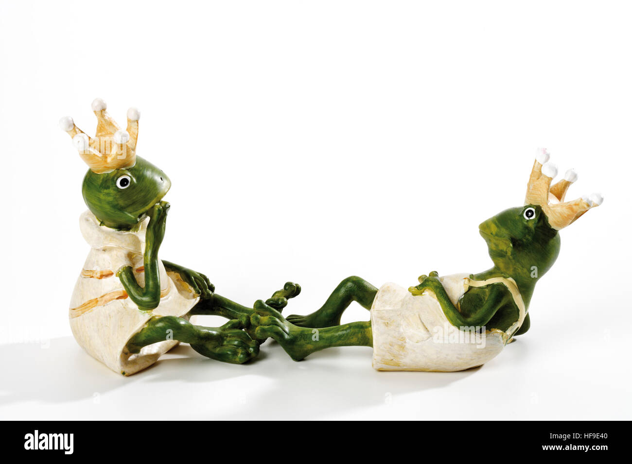Figurines, frogs wearing crown, sitting, contemplating Stock Photo - Alamy