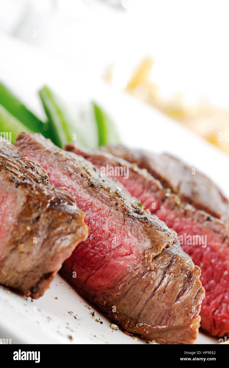 Steak cut into slices, closeup Stock Photo - Alamy
