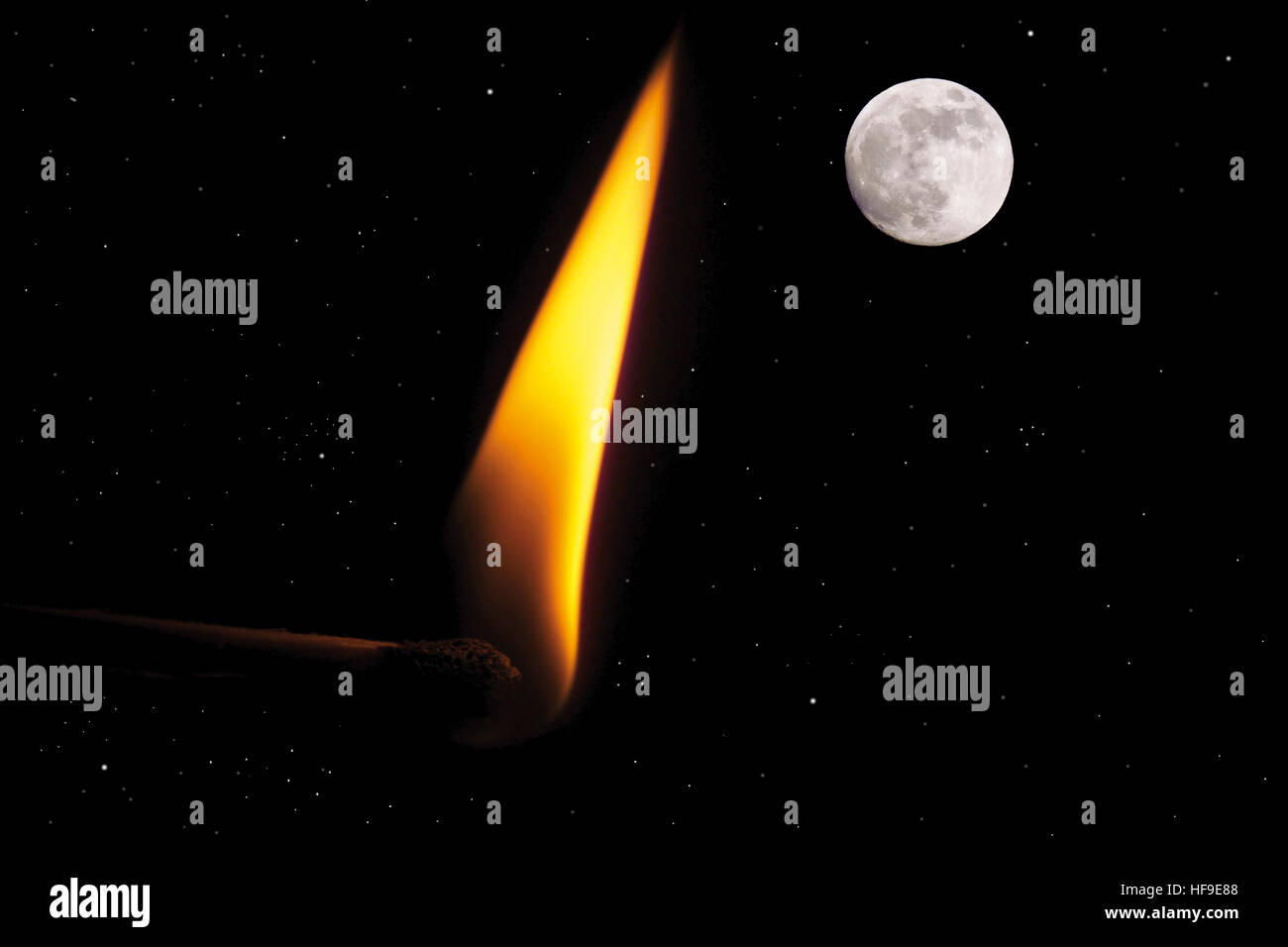 Lit match and the full moon Stock Photo - Alamy