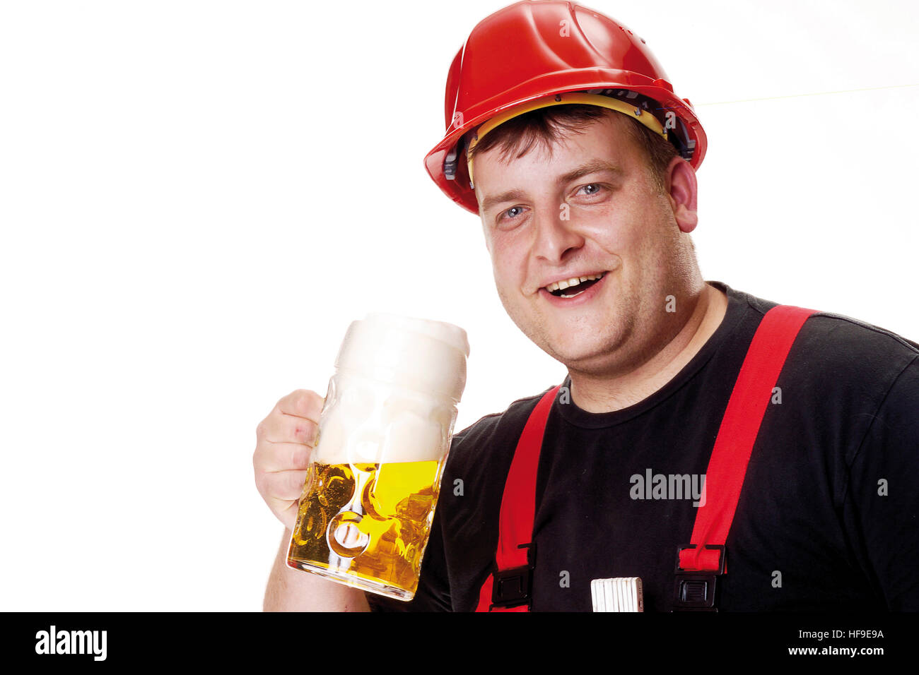 Construction worker wearing red hardhat holding a mug of beer Stock ...
