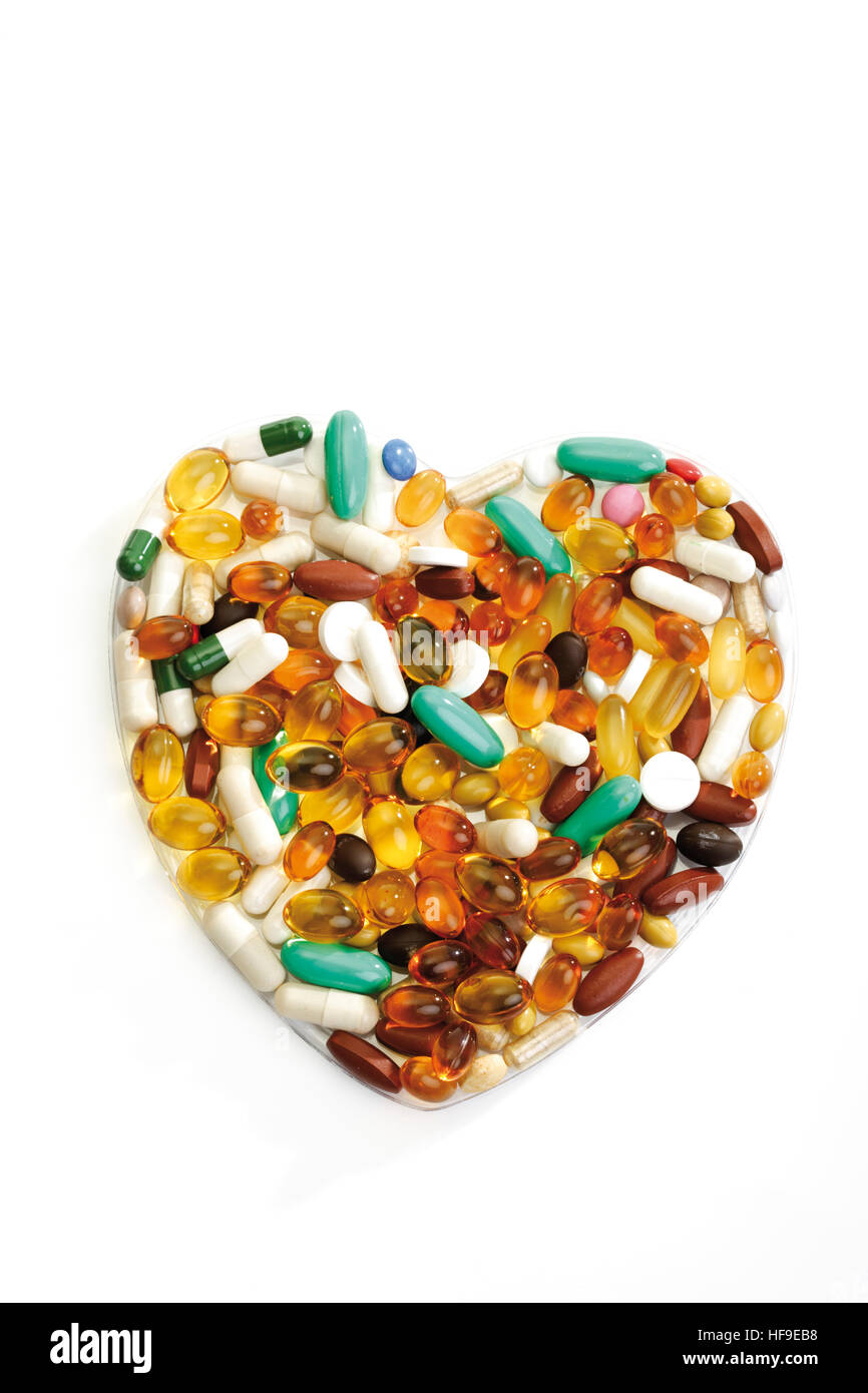 Pills formed in the shape of a heart Stock Photo - Alamy