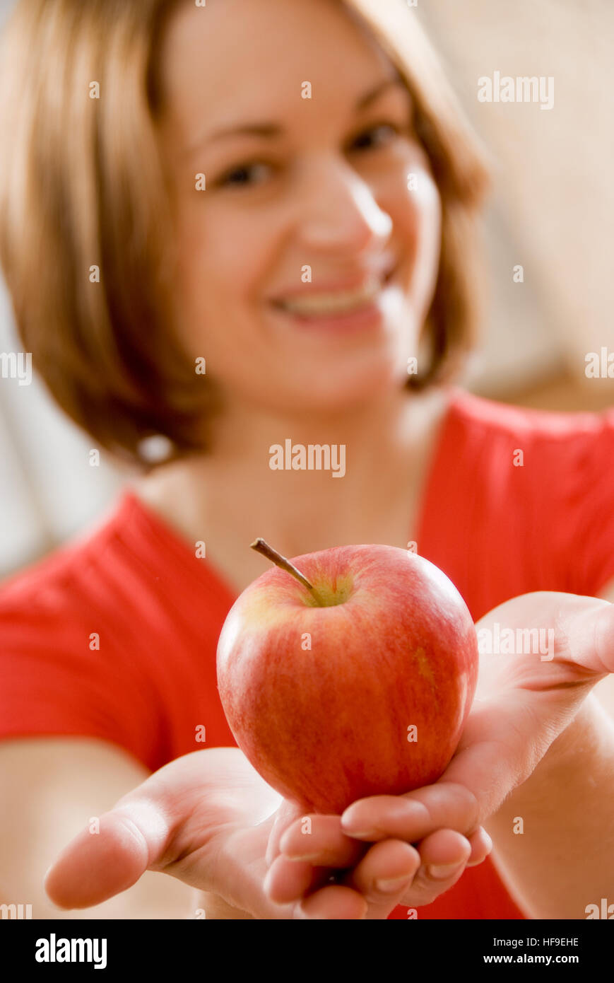 Young woman with apple Stock Photo - Alamy