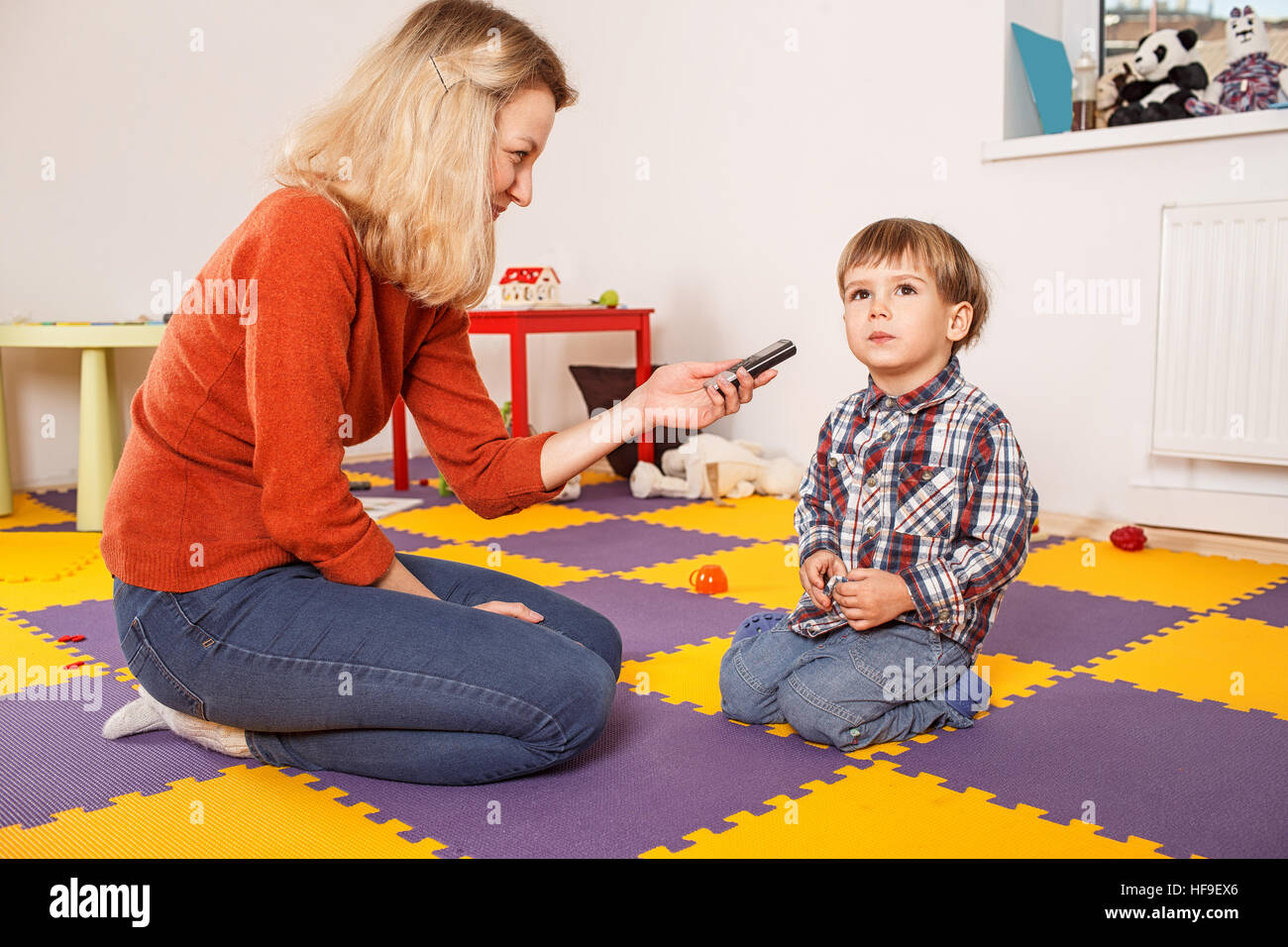 Child giving an interview to a journalist Stock Photo - Alamy