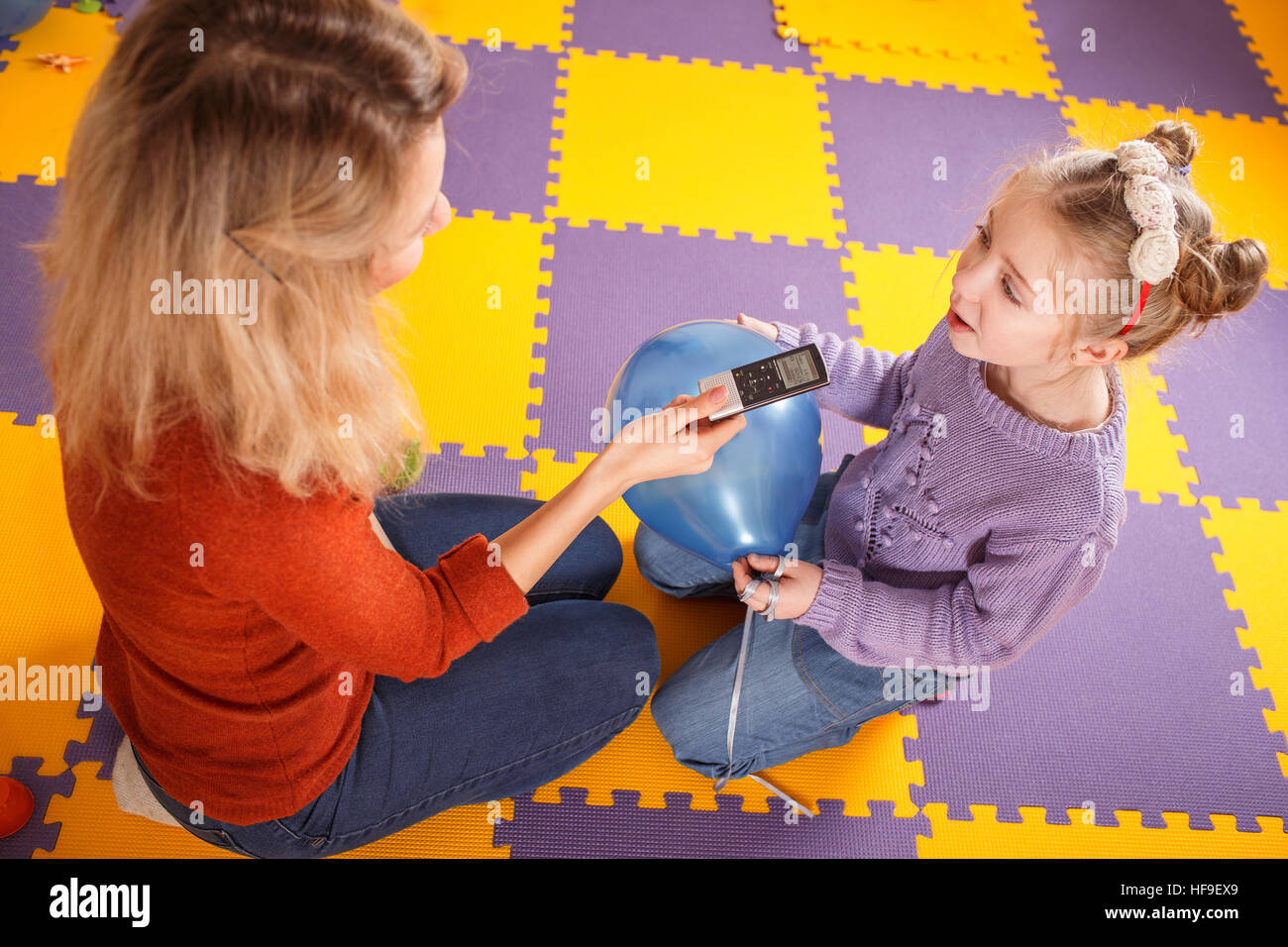 Seven years old girl giving an interview to a journalist Stock Photo ...