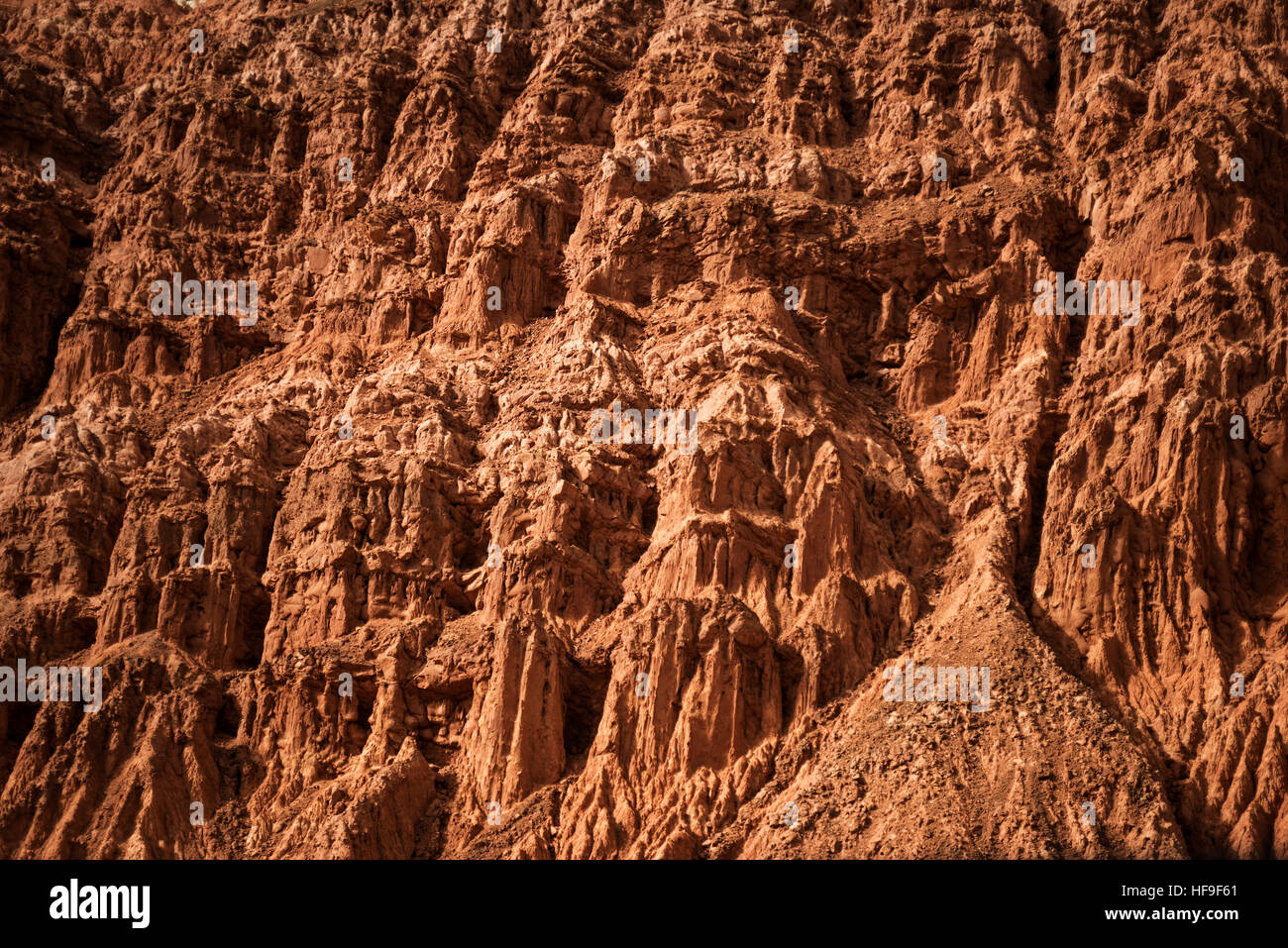 Red earth with strange formations in Purmamarca, Humahuaca Stock Photo ...