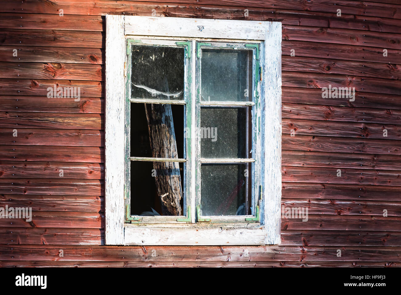 Broken window on an old red wooden house. Wooden debris inside Stock ...