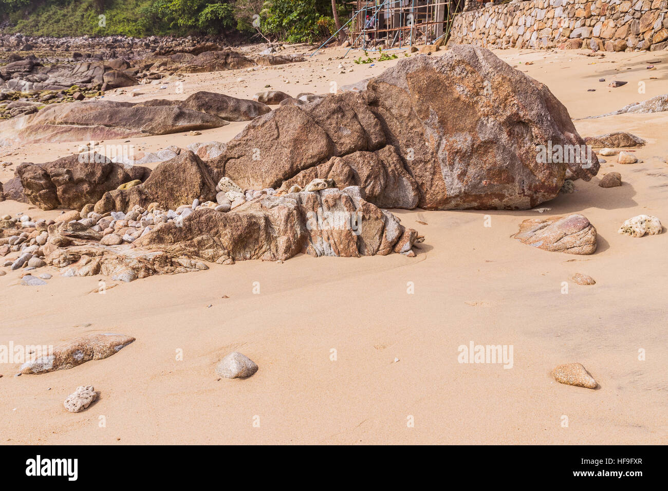 Rock exposed when low tide at Phuket, Thailand. It an be used as ...
