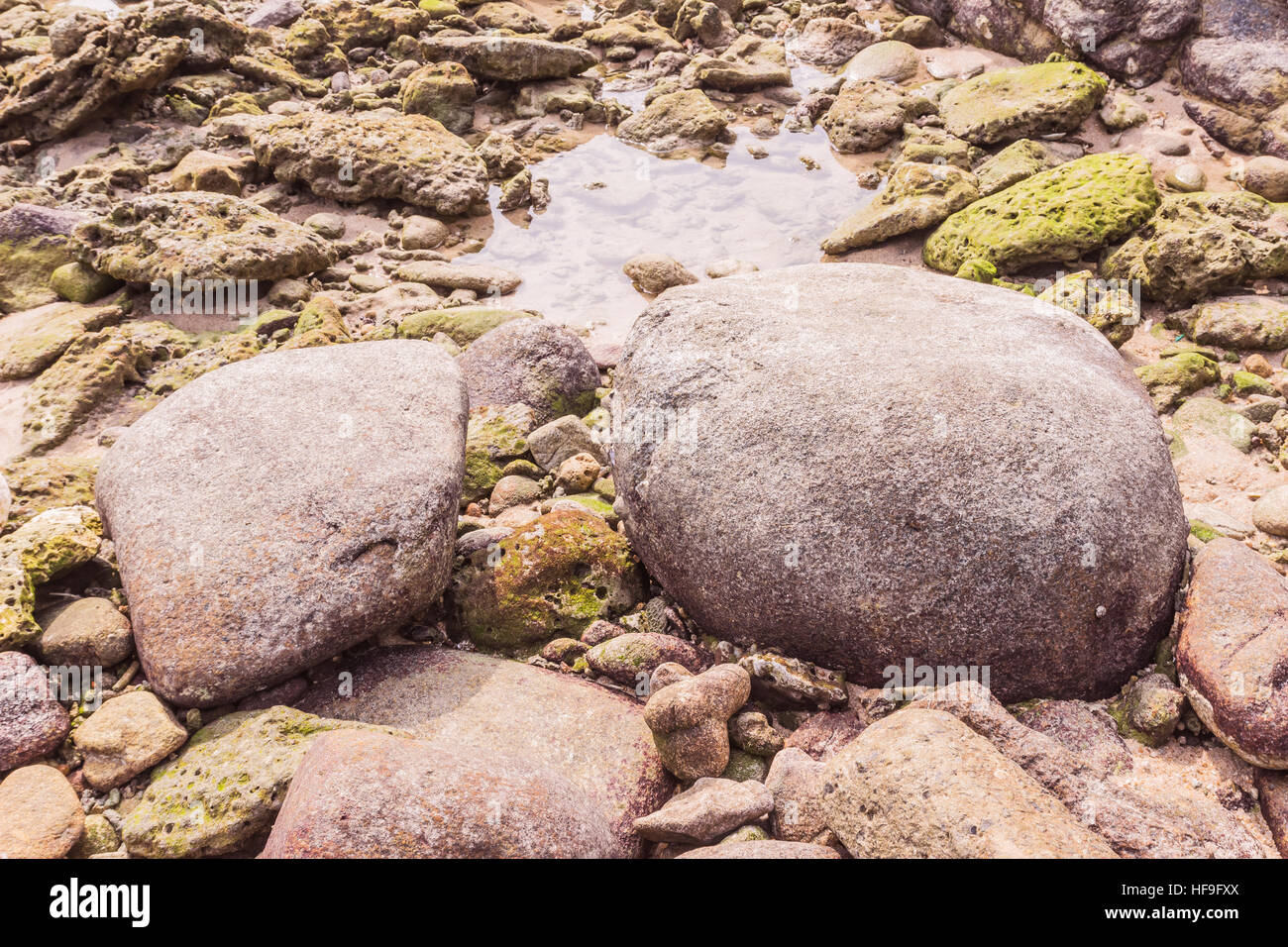 Rock exposed and sea water when low tide at Kalim beach, Phuket ...