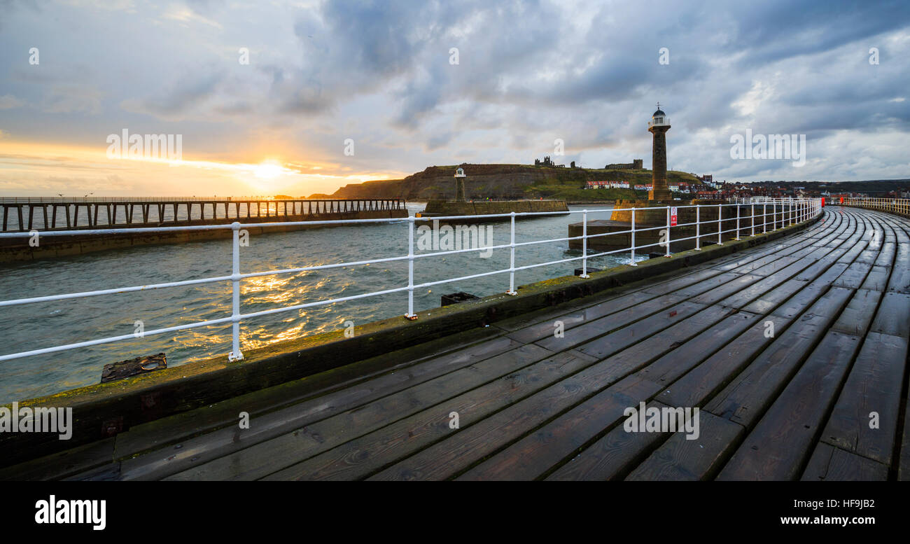 Whitby pier and harbour at sunrise. North Yorkshire, UK Stock Photo - Alamy