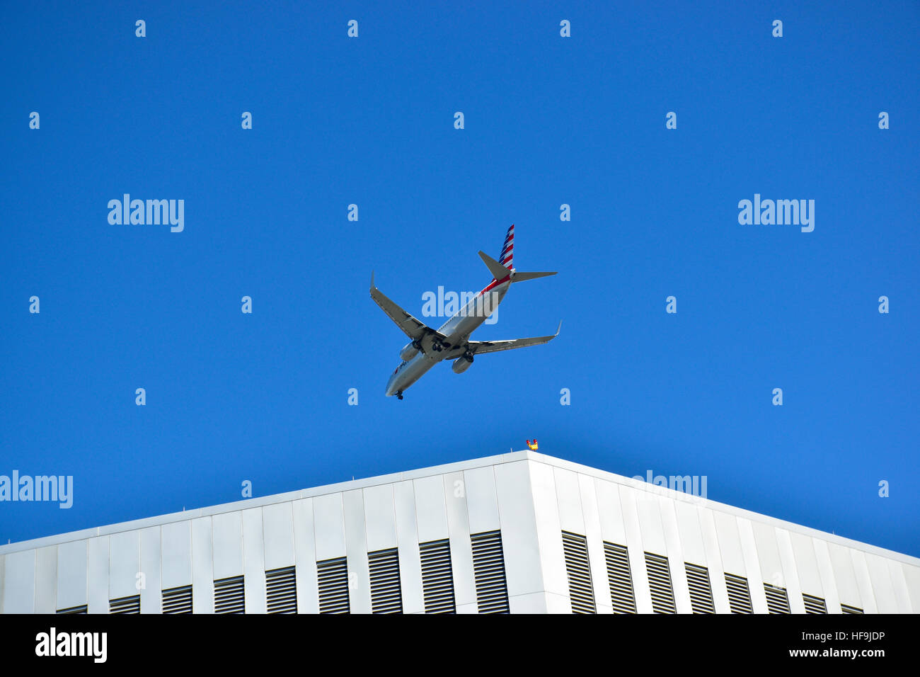 airplane near buildings Stock Photo - Alamy