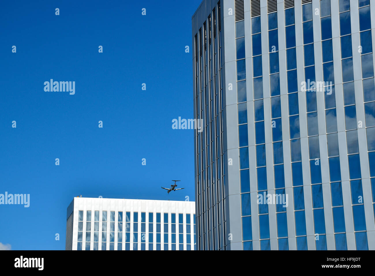 airplane near buildings Stock Photo - Alamy