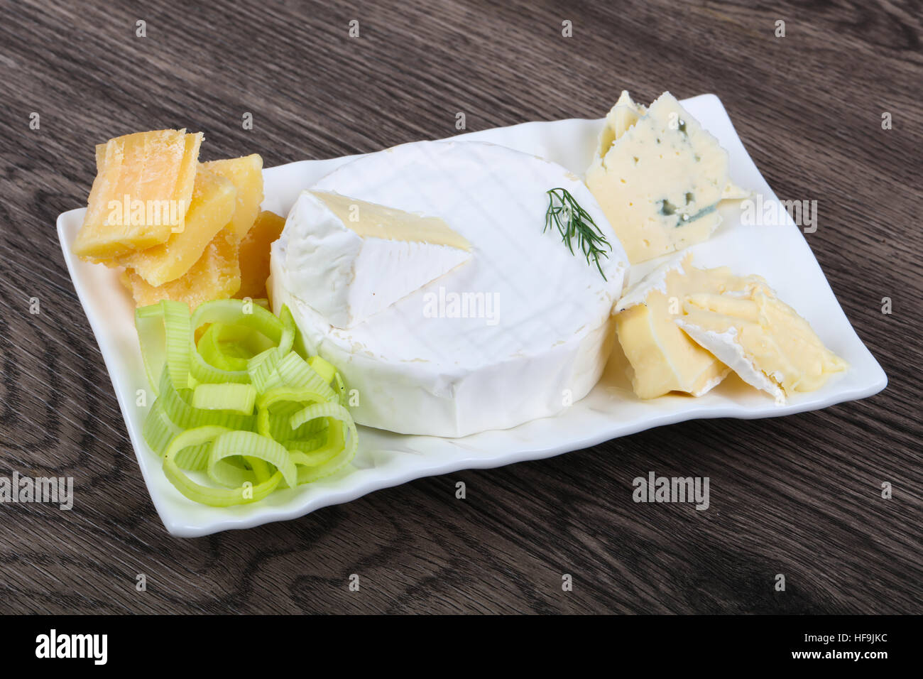 Cheese platter with brie, blue and parmesan Stock Photo - Alamy