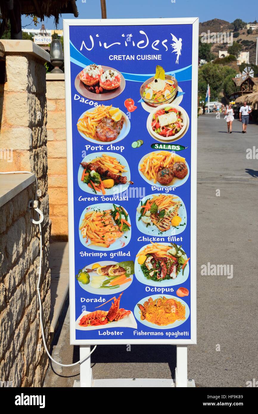 Greek and international menus painted outside a restaurant, Bali, Crete ...