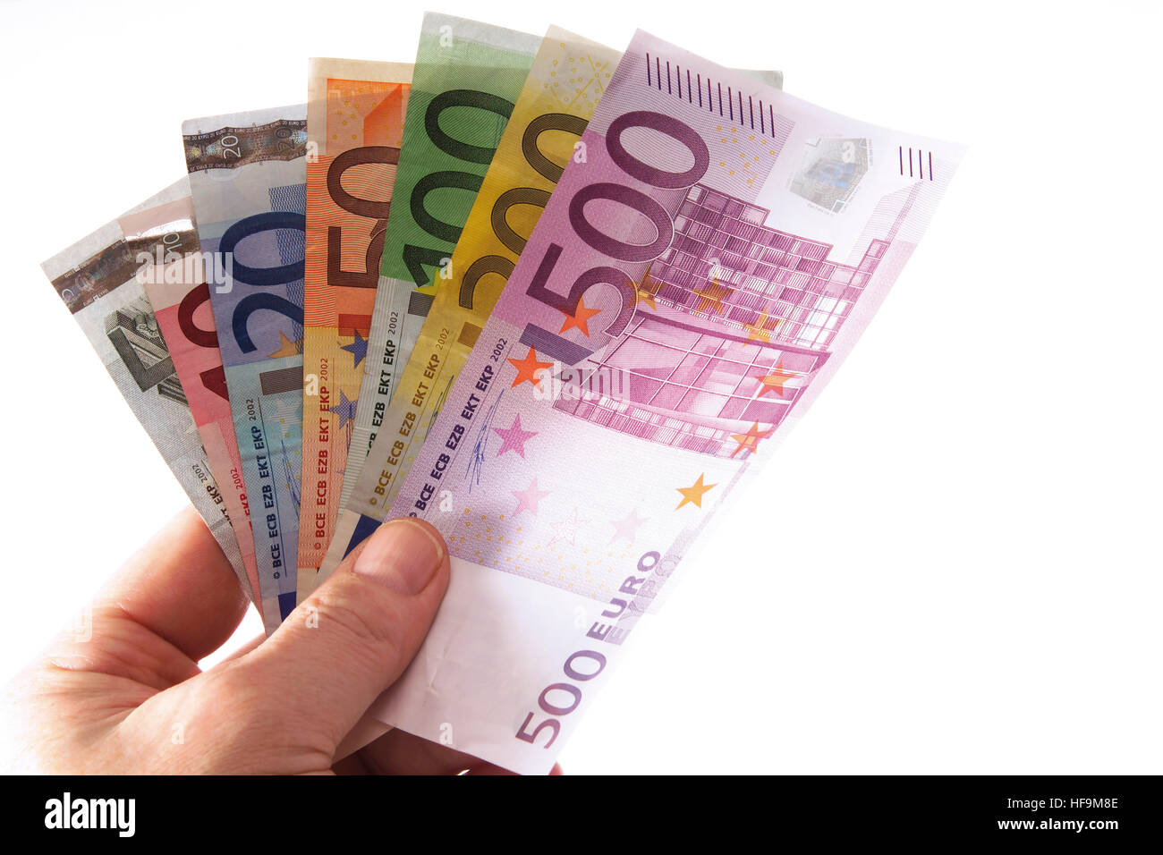 Hand holding Euro notes, fanned out Stock Photo - Alamy