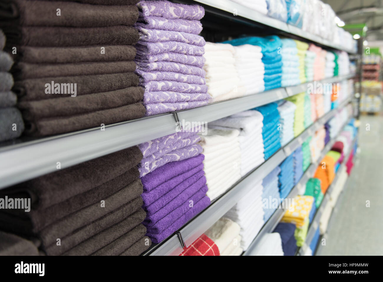 Big Shelf With a Colorful Stack Towels Stock Photo - Alamy