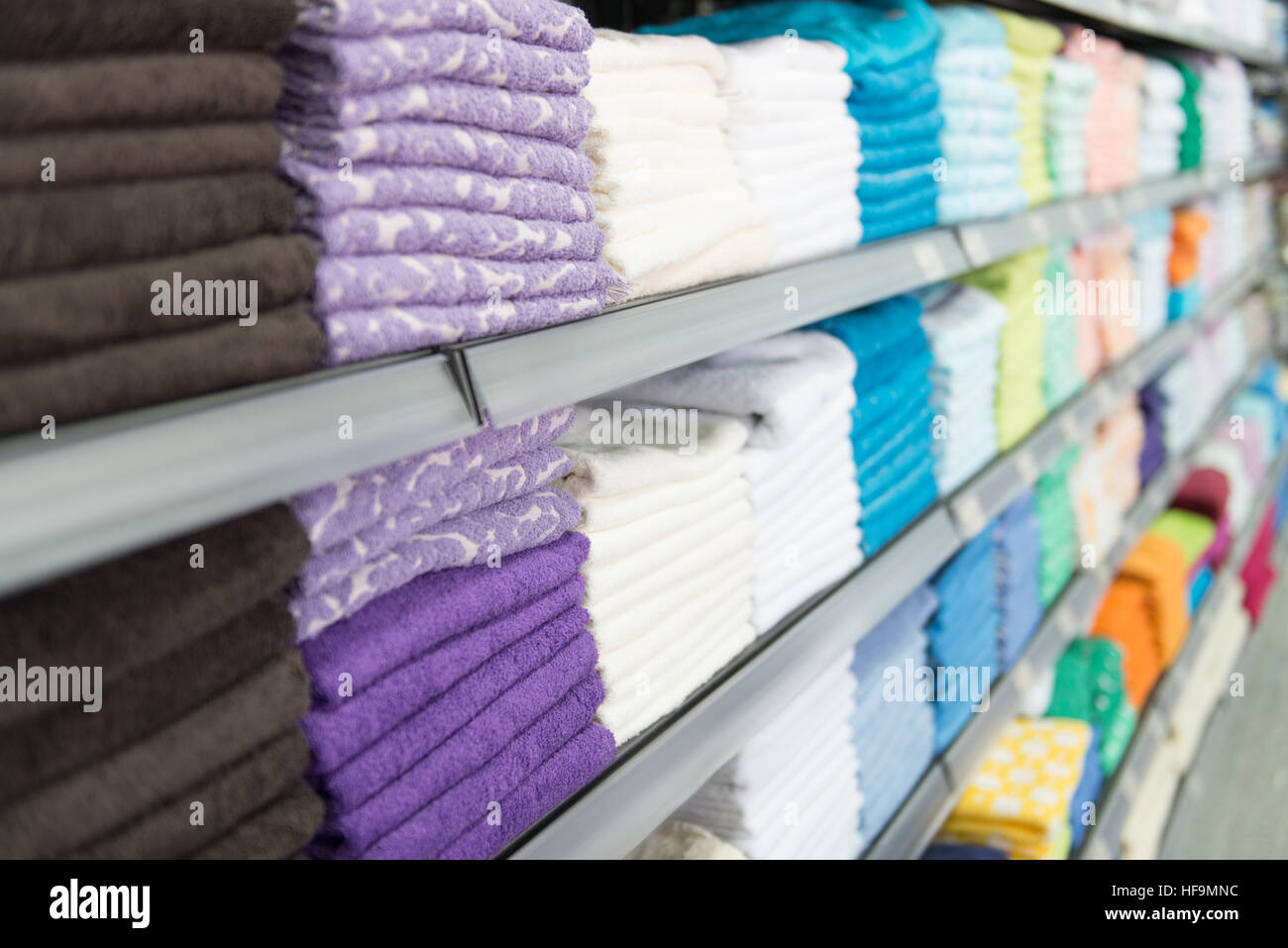 Big Shelf With a Colorful Stack Towels Stock Photo - Alamy