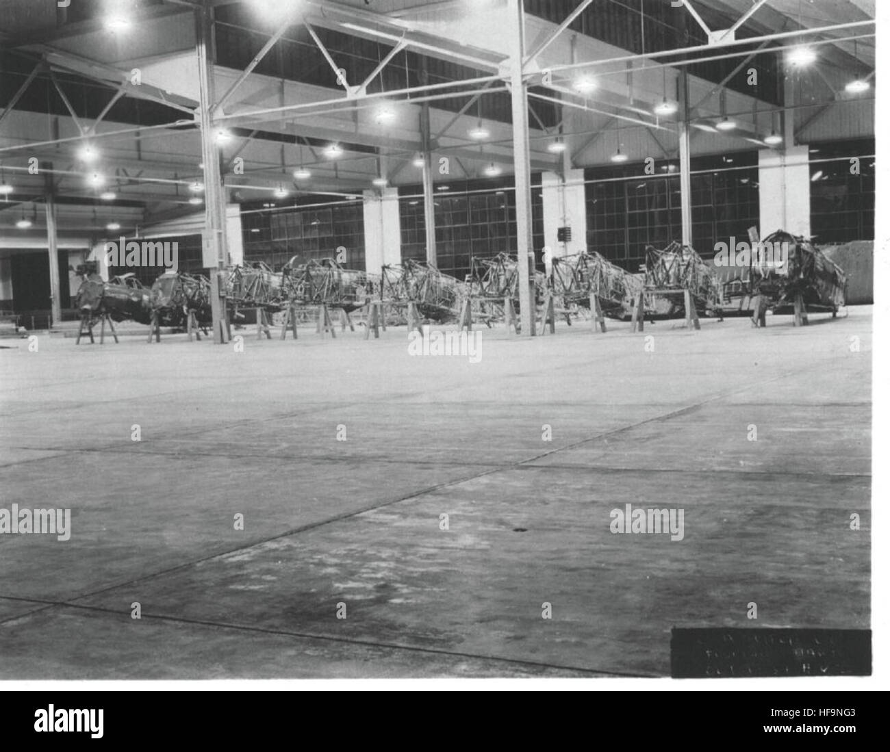 Photograph showing a fuselage assembly line in a historical aircraft ...