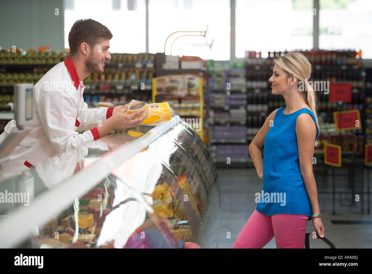 Beautiful Young Woman Shopping For Cheese In Produce Department Where ...