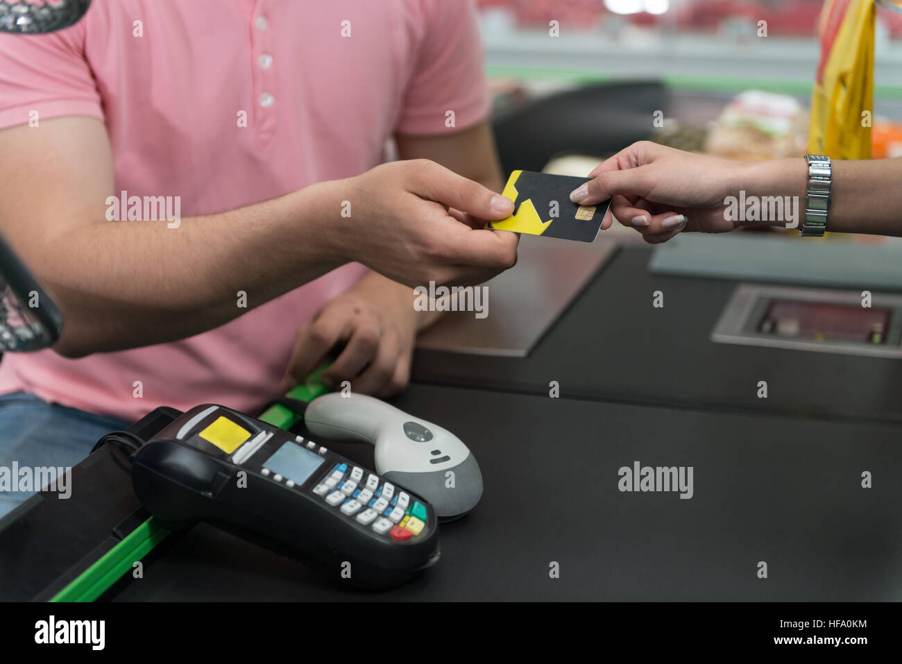 Close Up Woman Paying Groceries at Supermarket Checkout With Card Stock ...