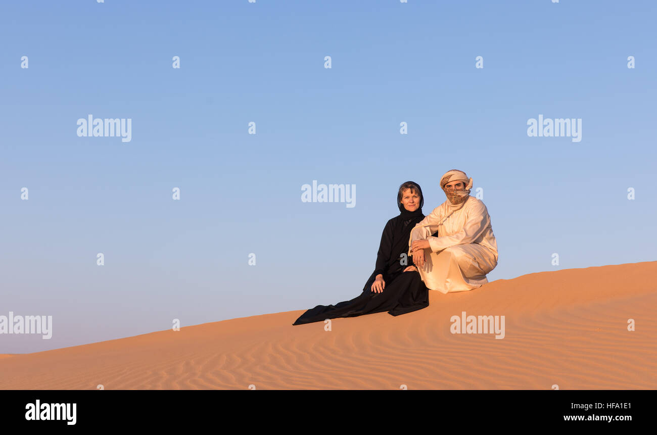 Couple in traditional arab dress Stock Photo - Alamy