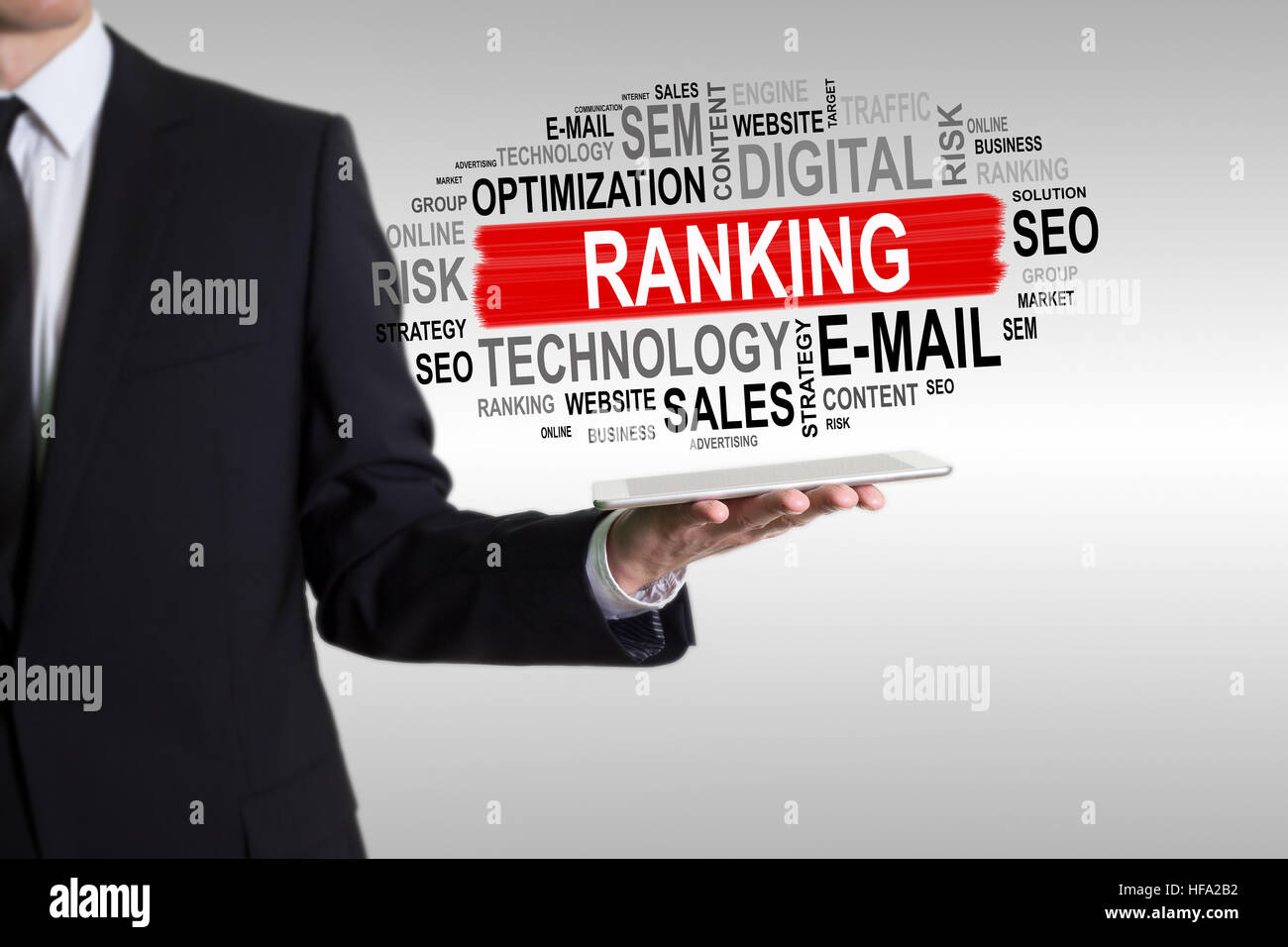 Ranking concept. Man holding a tablet computer Stock Photo - Alamy