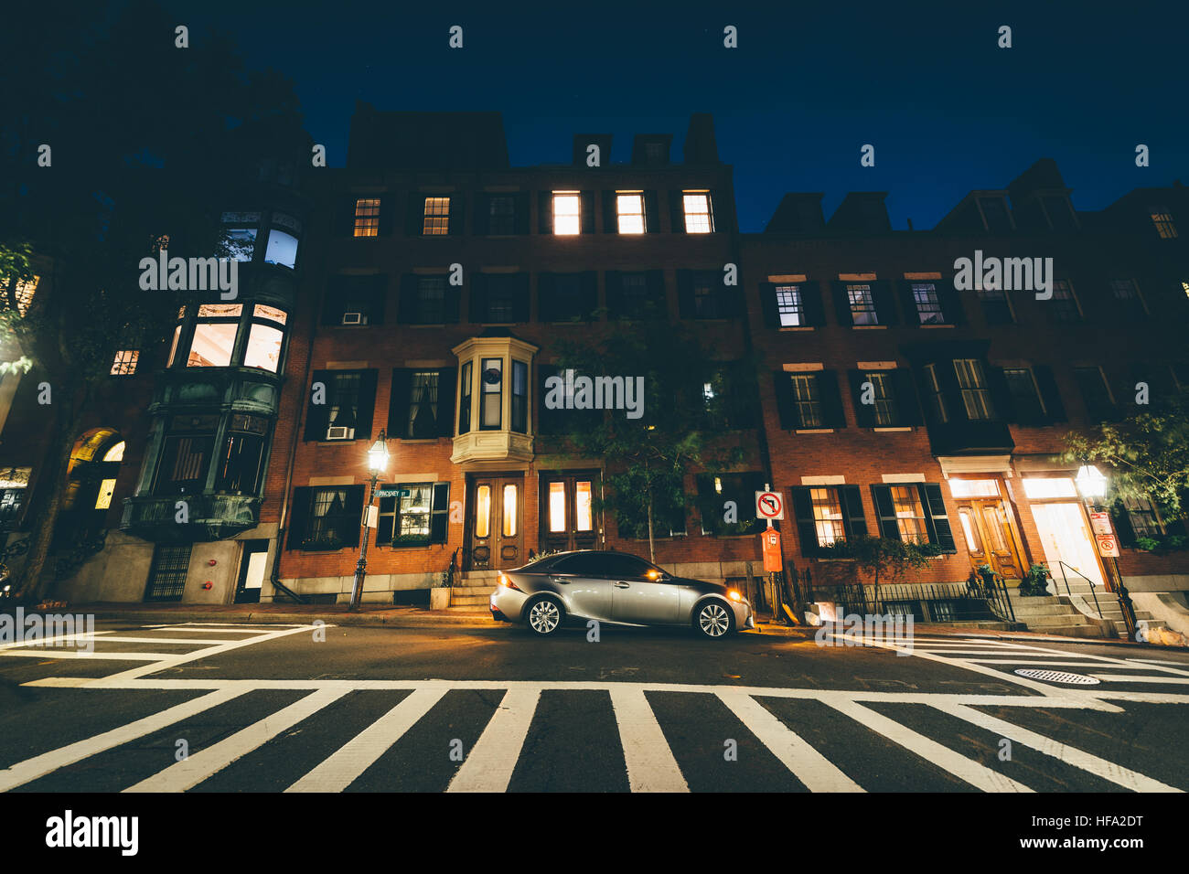 Intersection and buildings at night in Beacon Hill, Boston ...