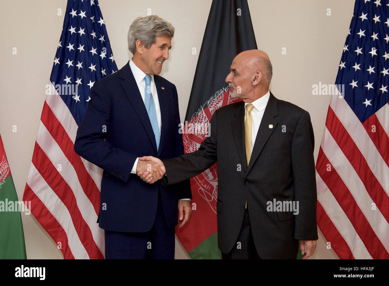 U.S. Secretary of State John Kerry shakes hands with Afghanistan ...