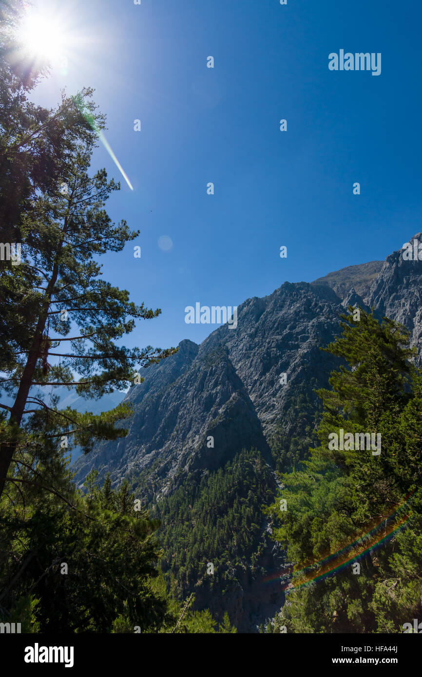 Samaria Gorge. Crete. Greece. Lens flare on the blue sky Stock Photo ...